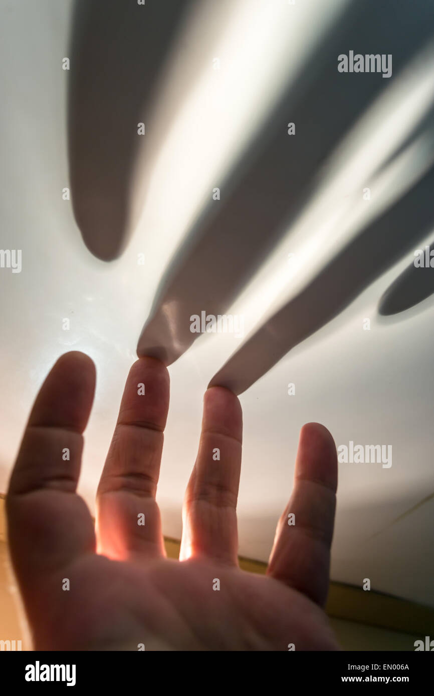 Shadows created by a human hand and fingers Stock Photo - Alamy