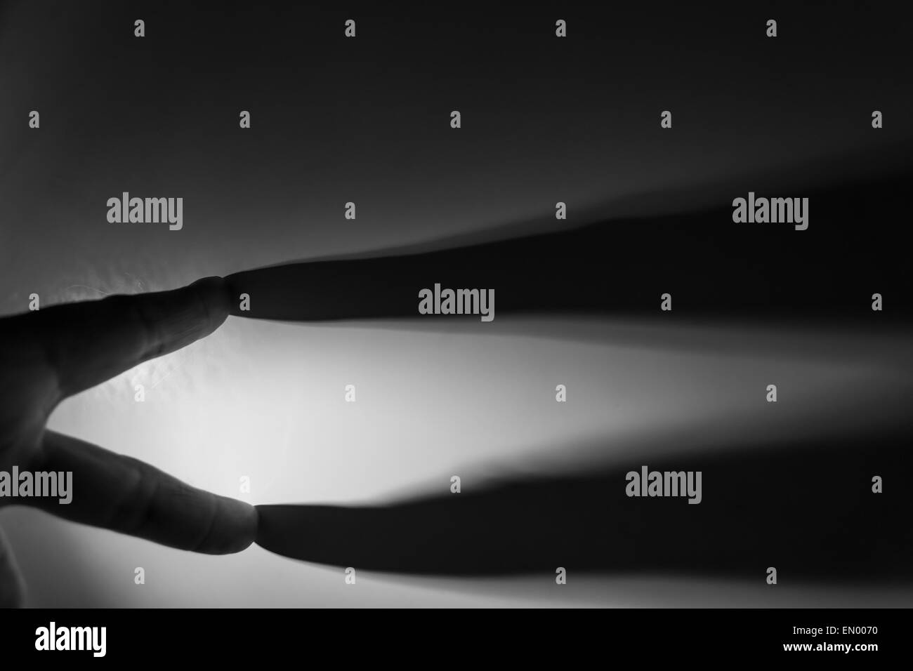 Shadows created by a human hand and fingers Stock Photo - Alamy