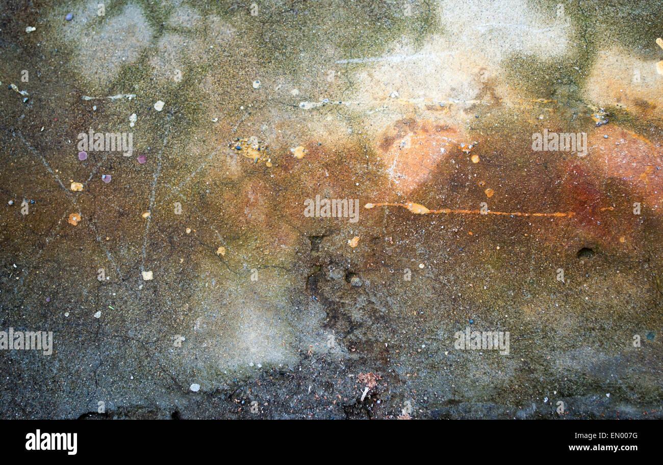 Rust and paint stains smear wet and drying concrete Stock Photo - Alamy
