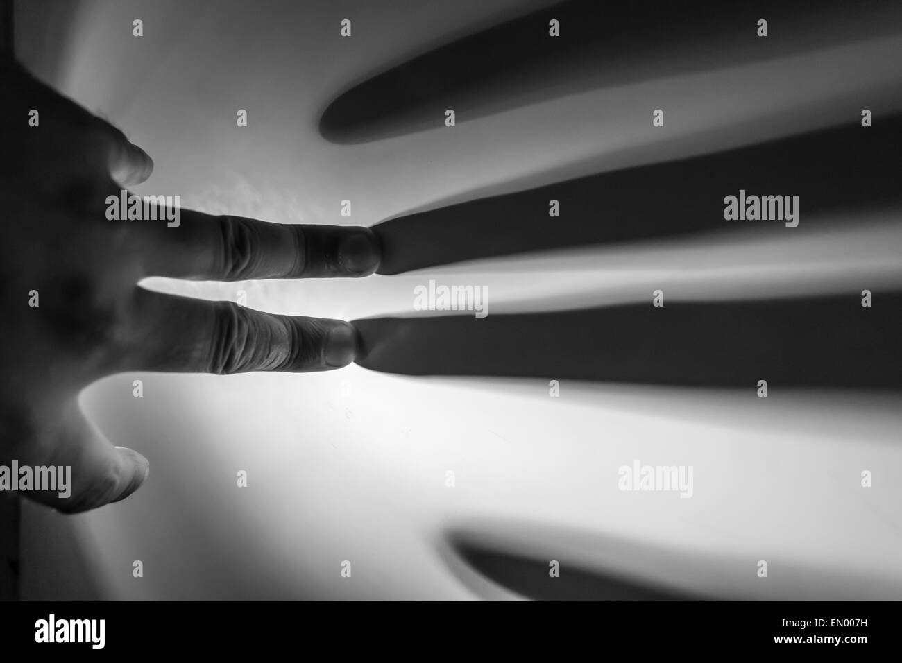 Shadows created by a human hand and fingers Stock Photo - Alamy