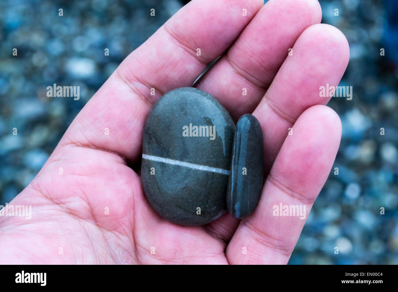 Stones icon in hand hi-res stock photography and images - Alamy