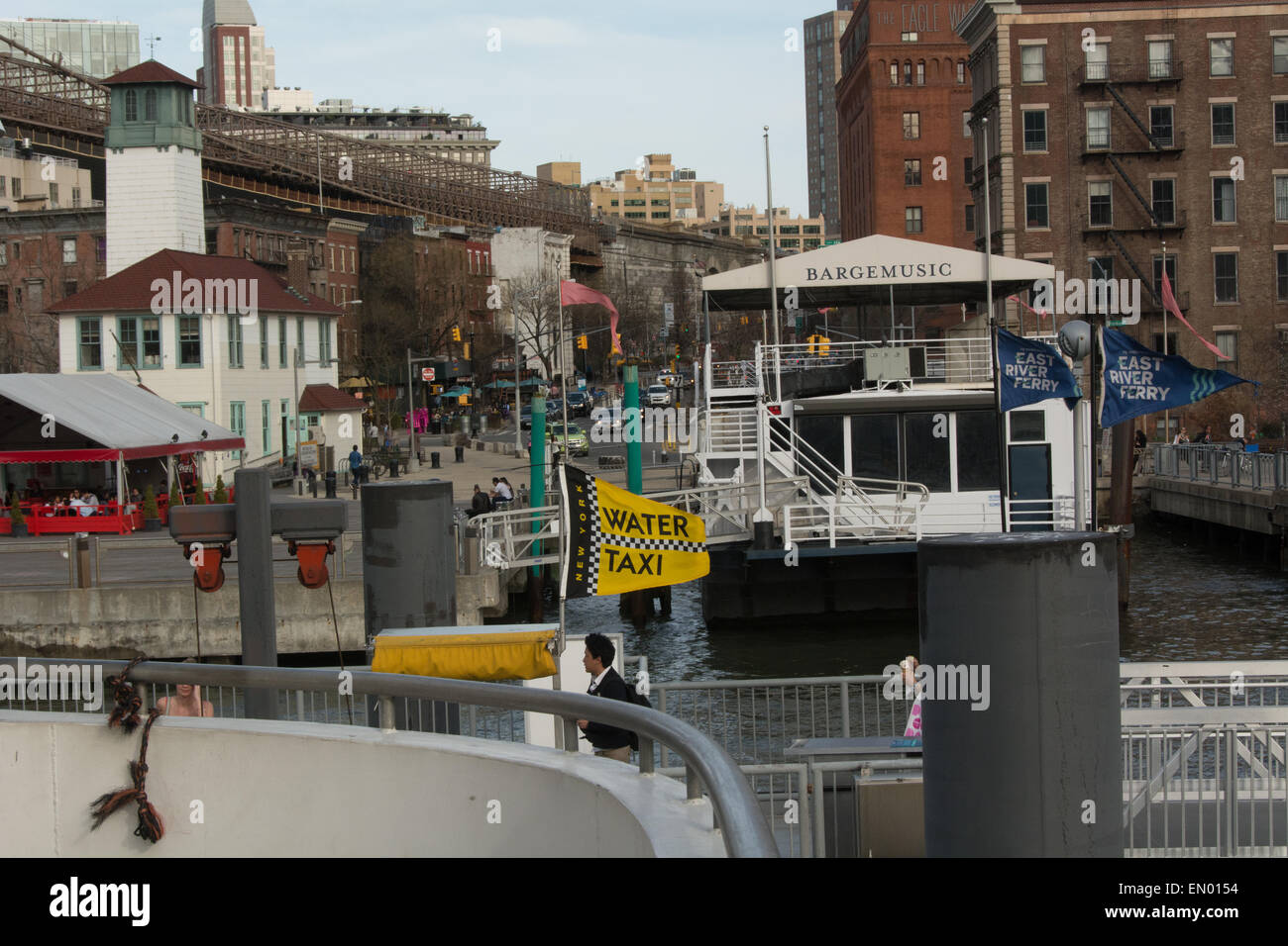 View of ferry dock and Brooklyn Bridge from deck of the East River ...
