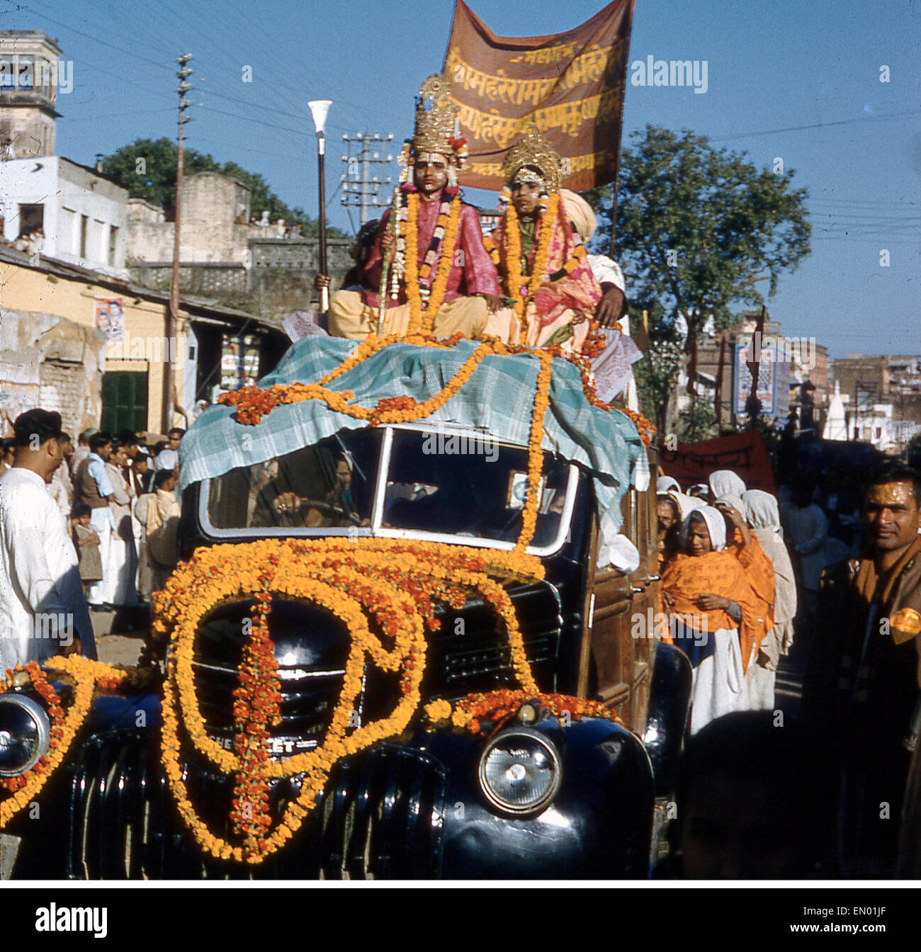 1960s, India, Benares, festival, a married couple sit on the roof of a ...