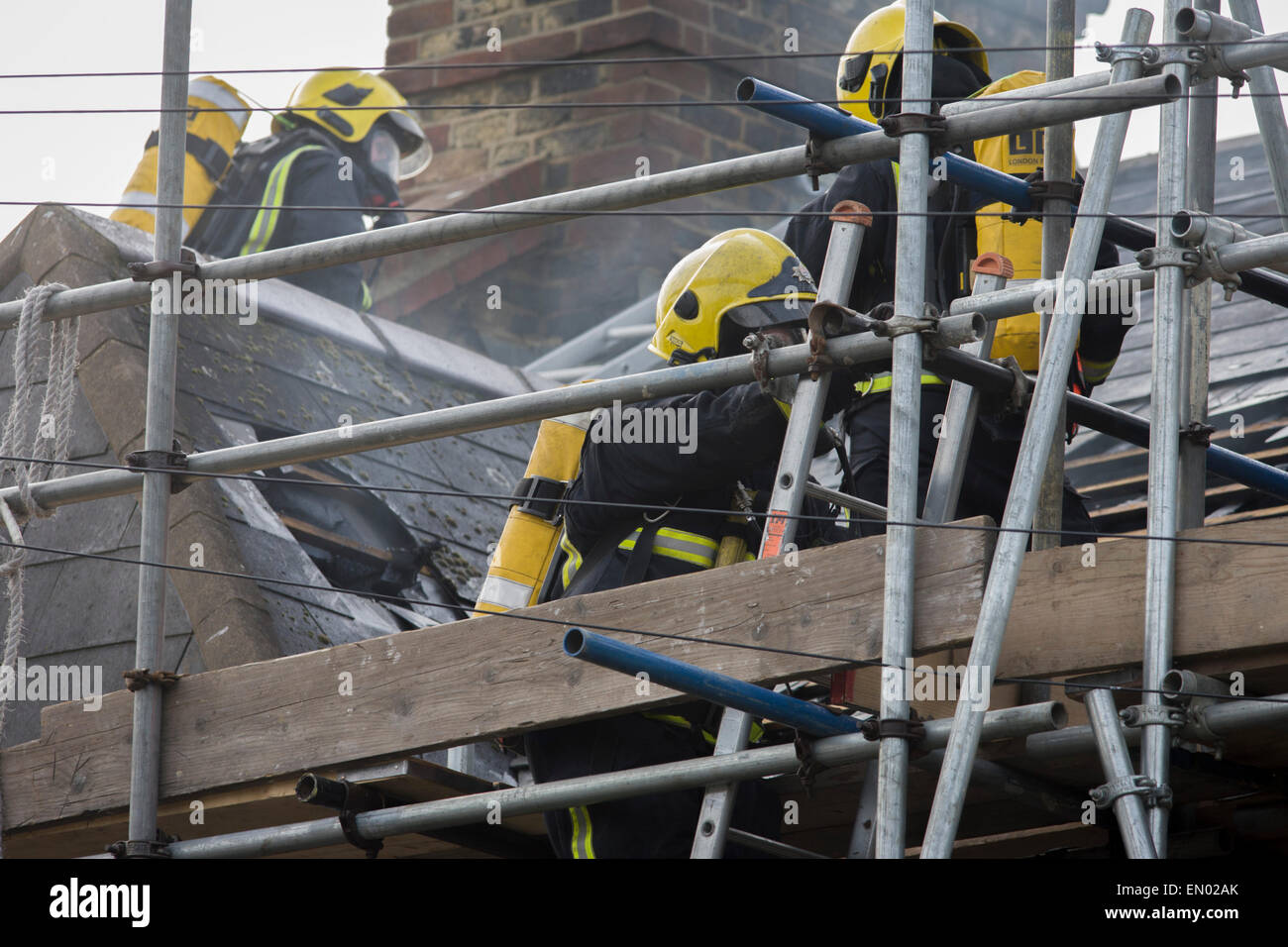 London Fire Brigade (LFB) firefighters attend a roof fire in Herne Hill ...