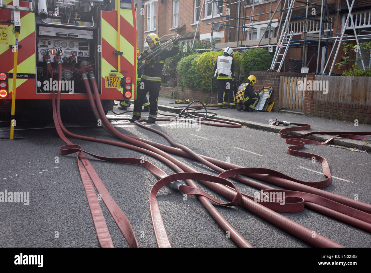 London Fire Brigade (LFB) firefighters attend a roof fire in Herne Hill ...
