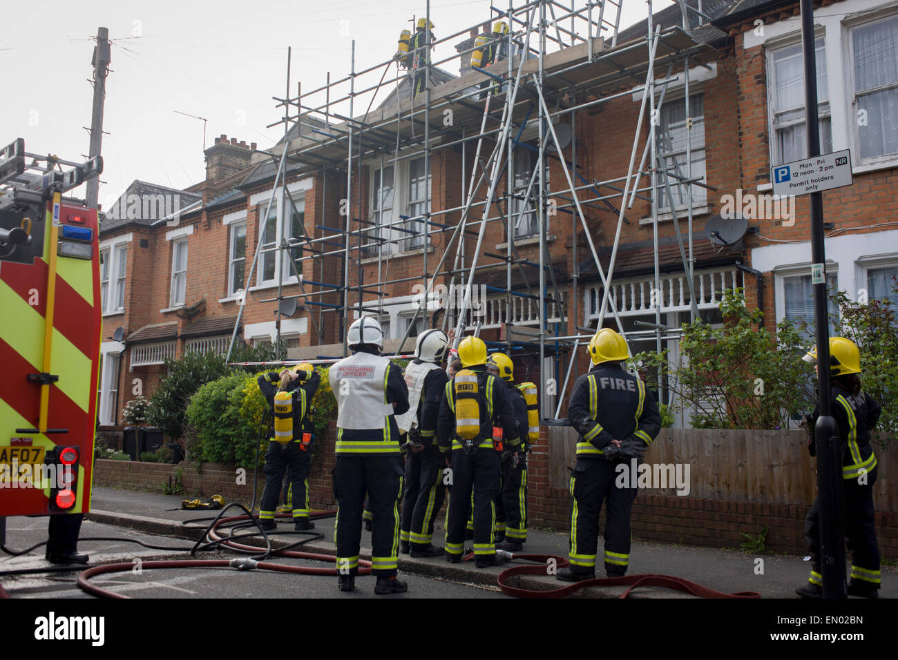 London Fire Brigade (LFB) firefighters attend a roof fire in Herne Hill ...