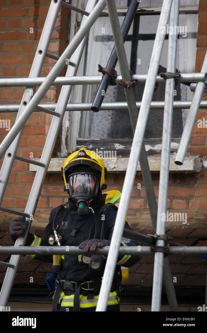 London Fire Brigade (LFB) firefighters attend a roof fire in Herne Hill ...