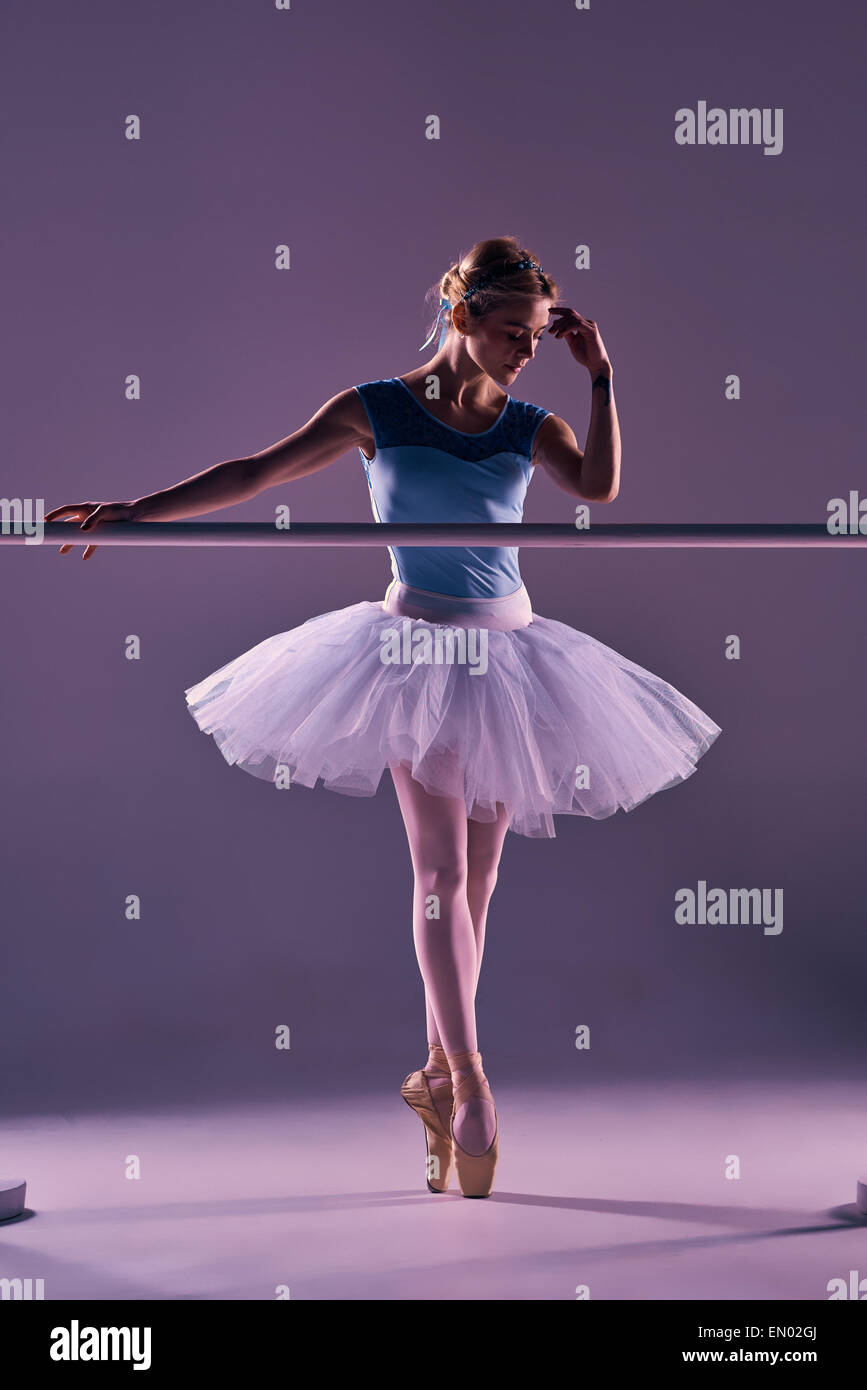 classic ballerina posing at ballet barre Stock Photo - Alamy