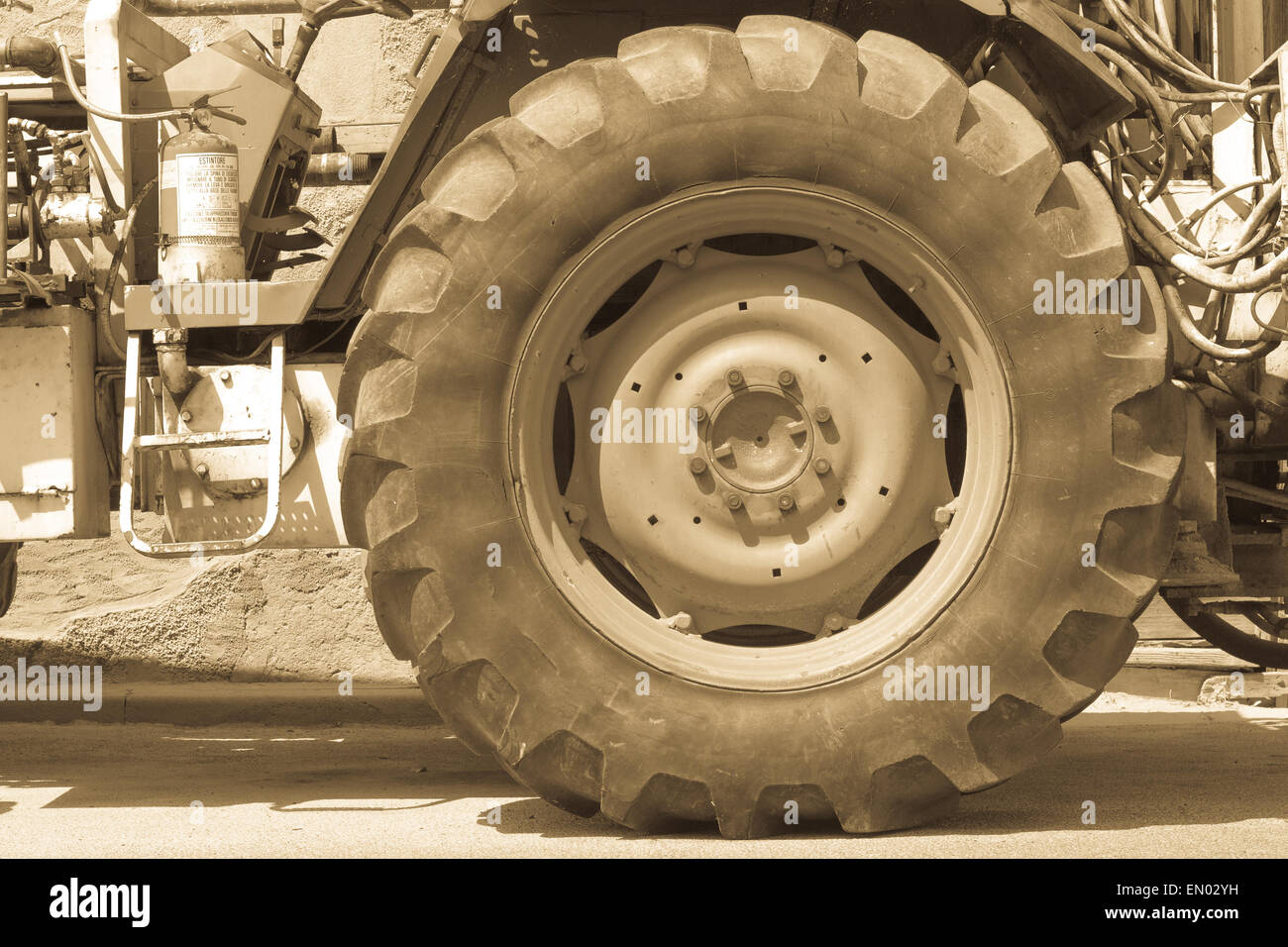 Driving wheel in old tractor. antiqued version Stock Photo - Alamy