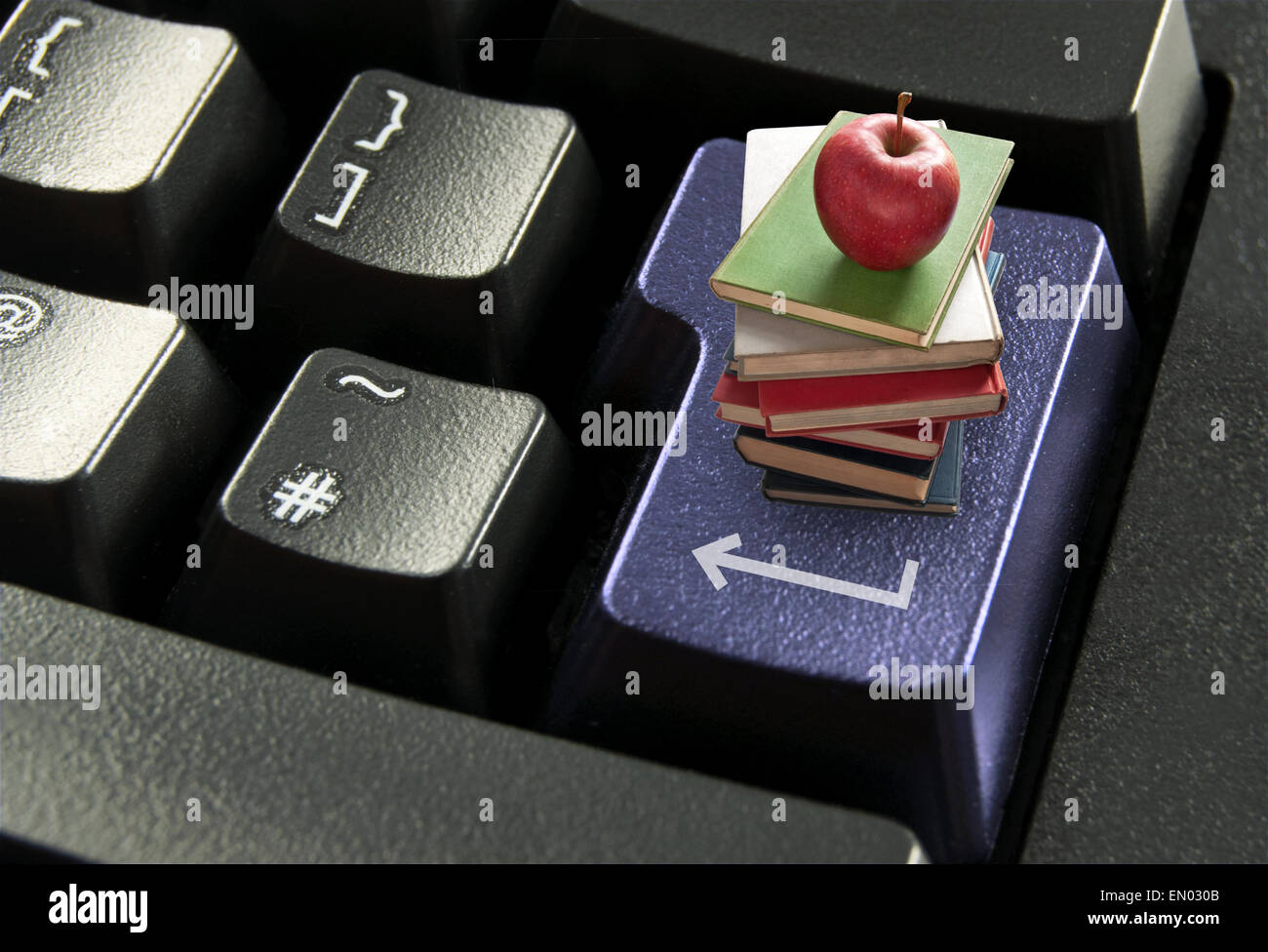 Stack of books computer enter key for education and learning Stock ...