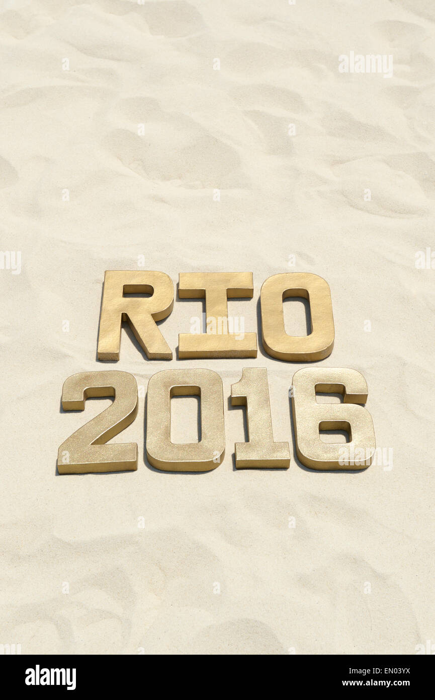 Golden Rio 2016 sign sitting on sand beach background in Rio de Janeiro ...