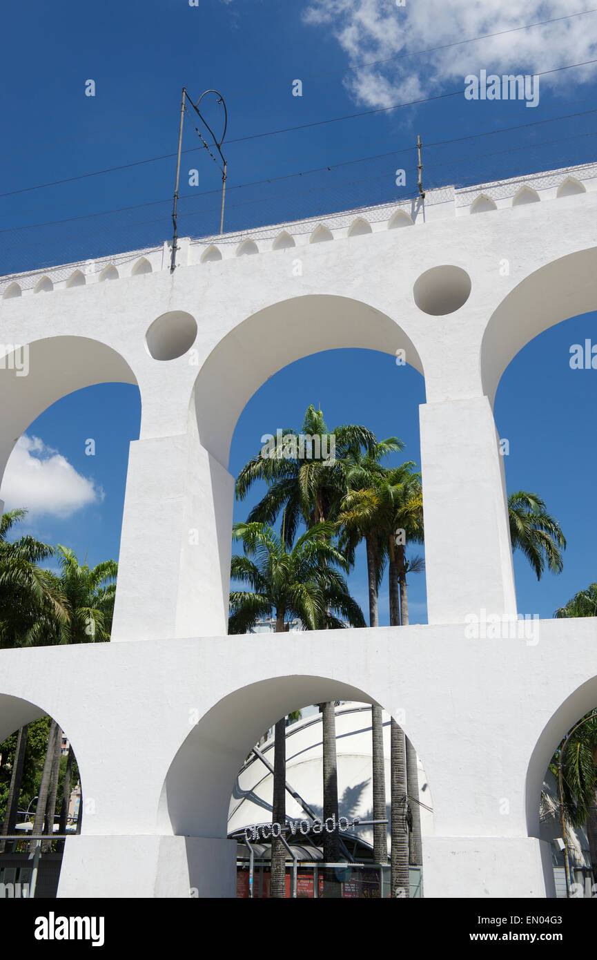 Lapa Arches Rio de Janeiro Brazil close-up with palm trees under bright ...