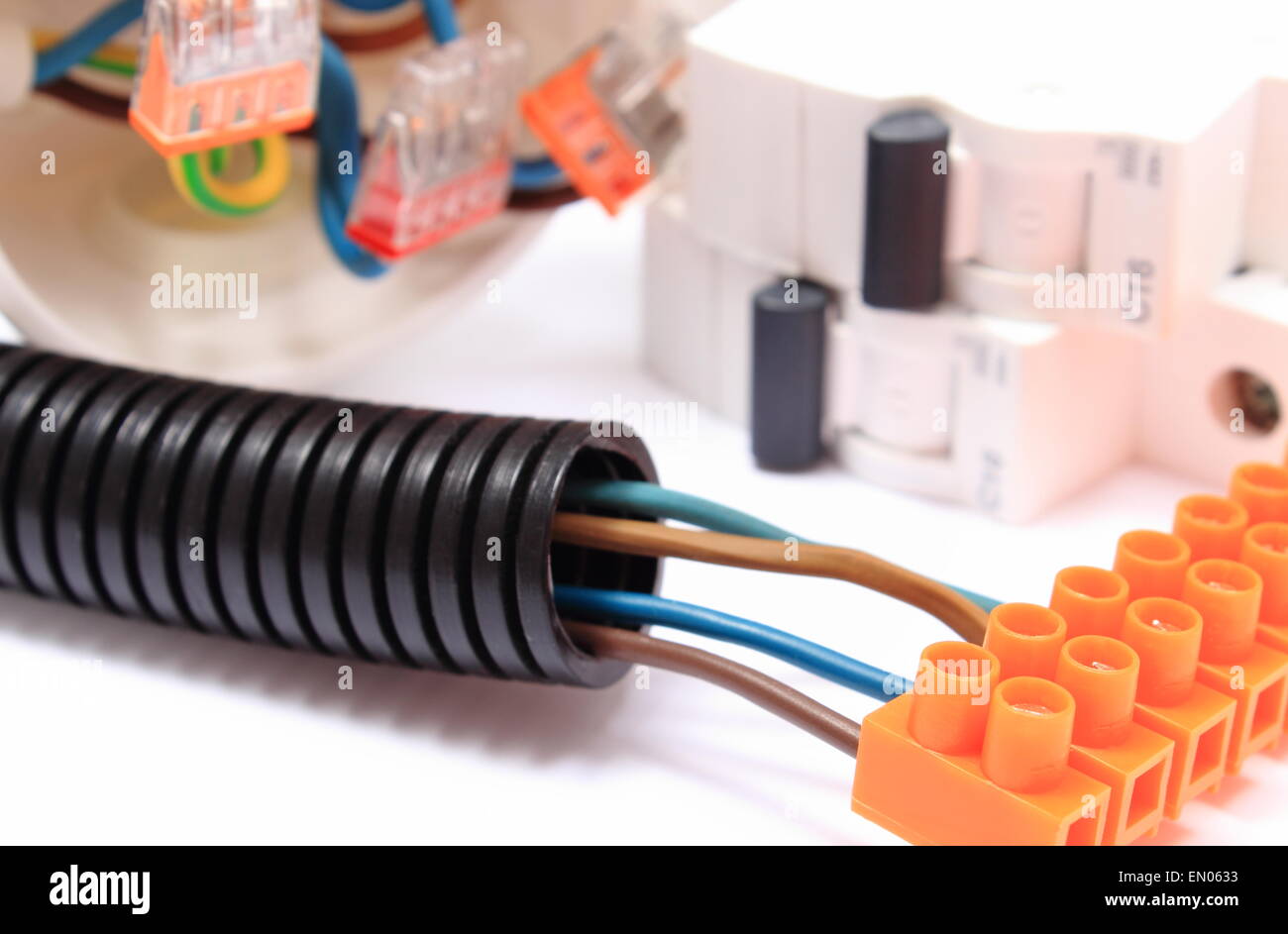 Corrugated plastic pipe, cable with connection block and electric fuse ...