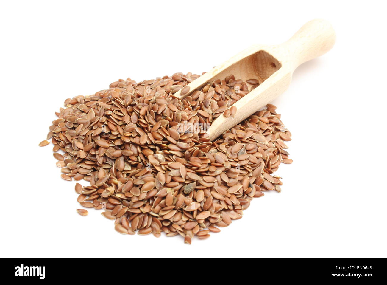 Heap of brown linseed with wooden spoon. Isolated on white background Stock Photo - Alamy