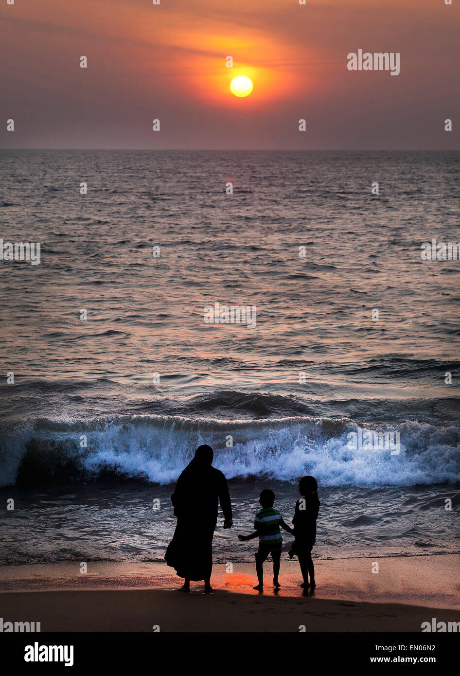 SRI LANKA,Colombo: family watching the waves on Colombo ocean front ...