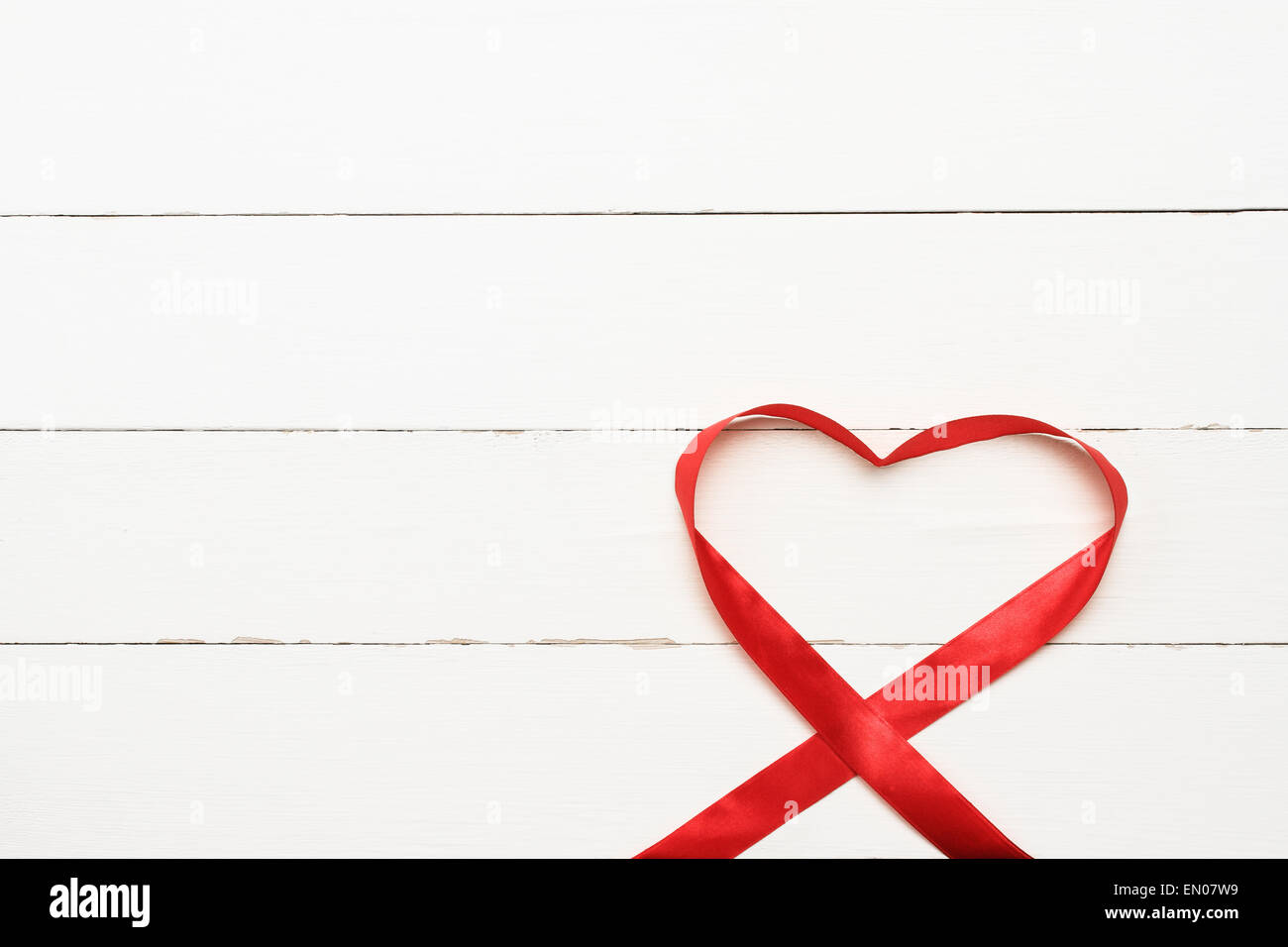 White background with heart shaped ribbon Stock Photo - Alamy