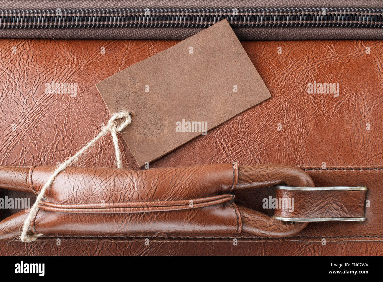 Leather tag on leather travel case Stock Photo - Alamy
