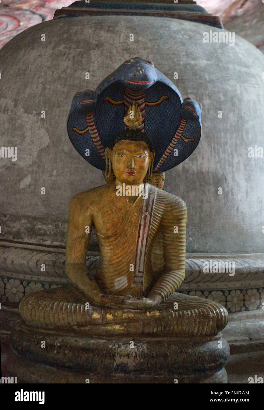 Dambulla Cave Temple,Sri Lanka: sitting Buddha with a cobra behind ...