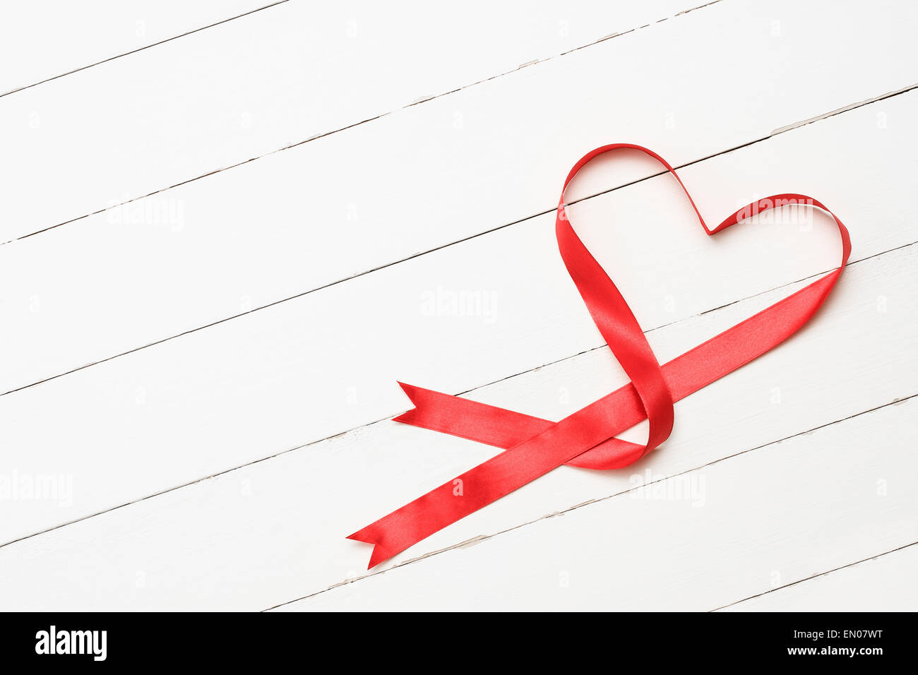 White background with heart shaped ribbon Stock Photo - Alamy