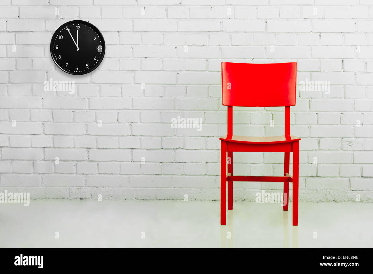 Red chair with clock Stock Photo - Alamy