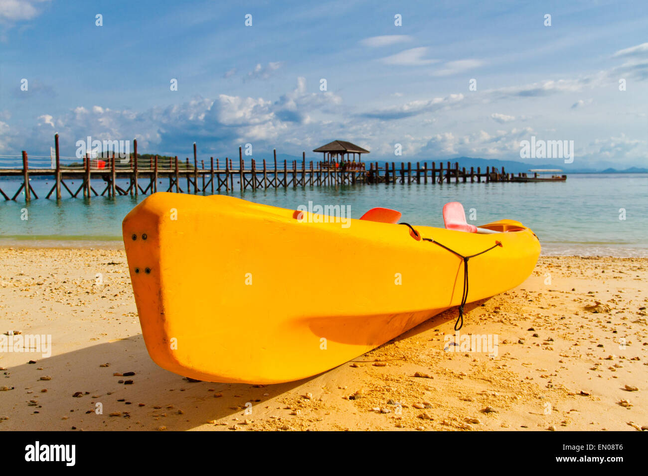 Yellow kayak on beach Stock Photo - Alamy
