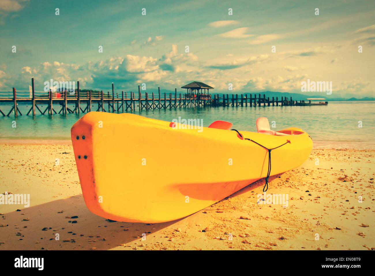 Yellow kayak on beach Stock Photo - Alamy