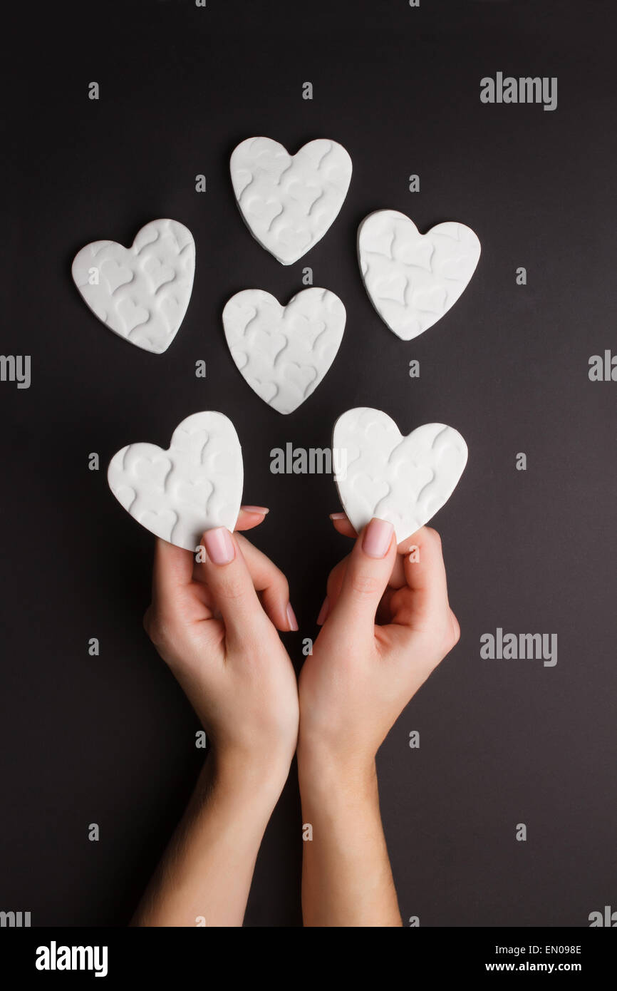 Hand holding little hearts Stock Photo - Alamy