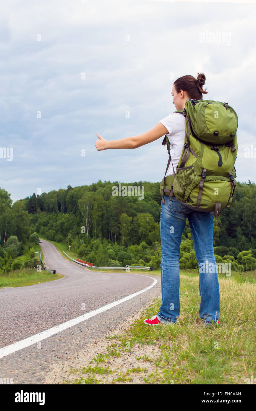 Woman with backpack Stock Photo - Alamy