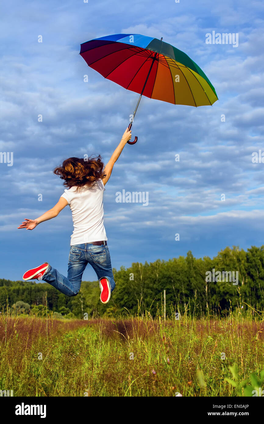 Woman flying with umbrella hi-res stock photography and images - Alamy