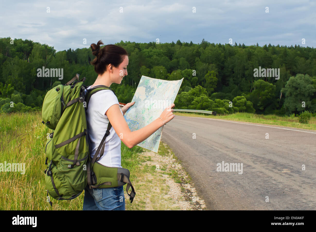 Woman hiker reading map Stock Photo - Alamy