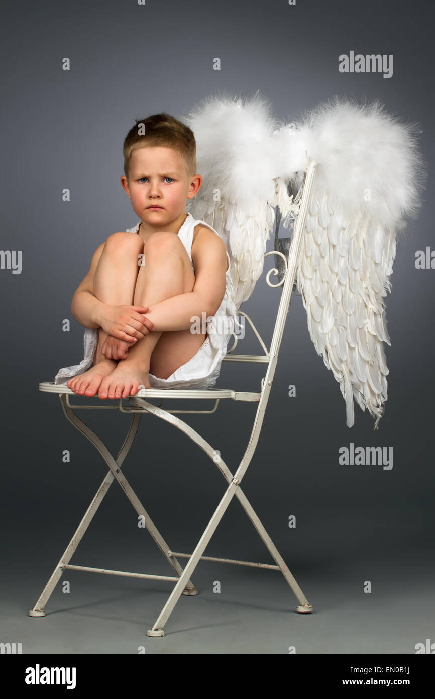 Sad angel kid Stock Photo - Alamy