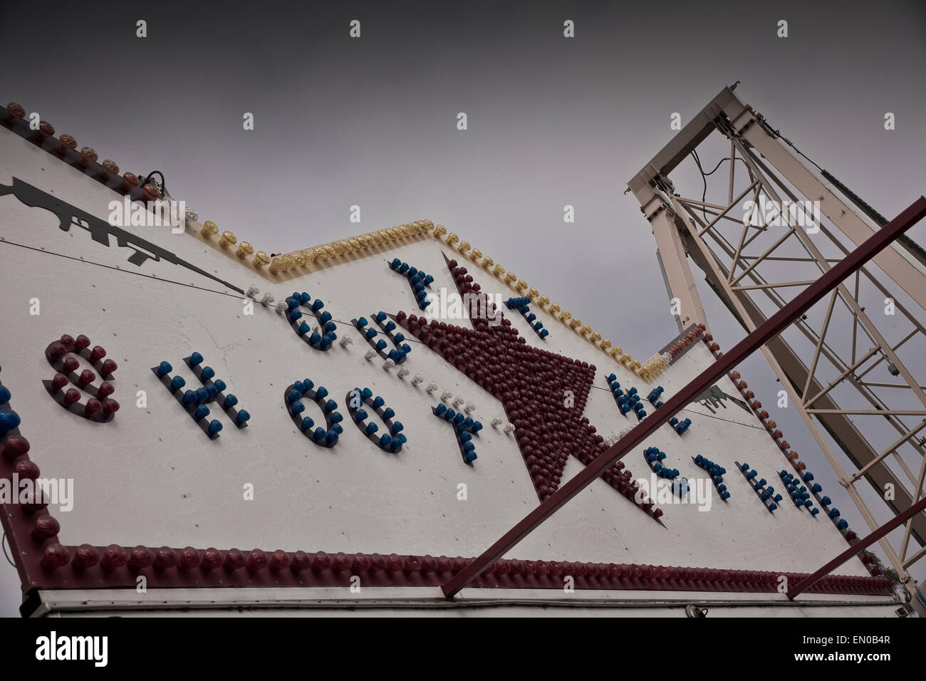 The Shooting Star shooting range at a carnival street fair under a dark ...