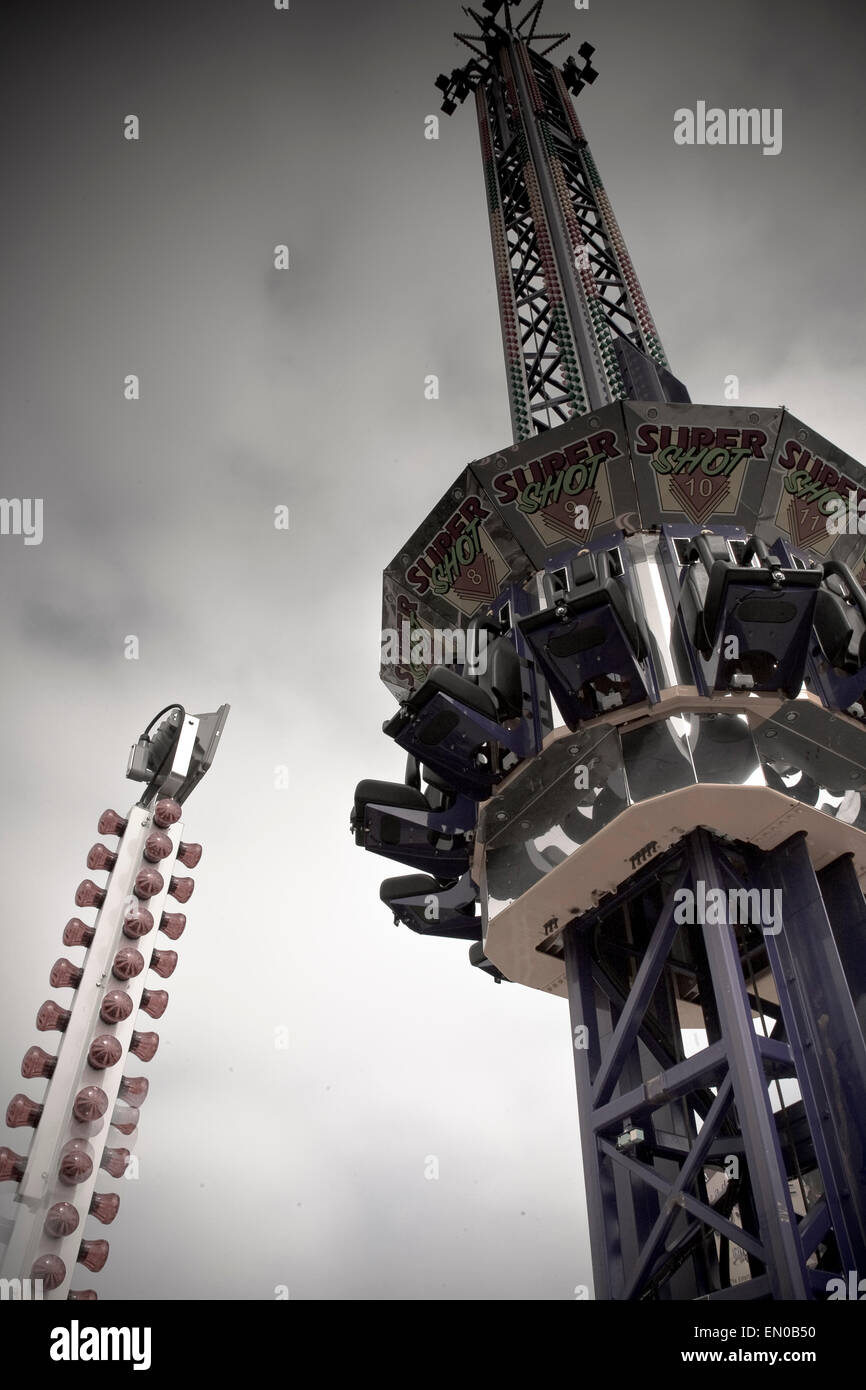 The tower of a super slider ride under a gray and stormy sky at a ...