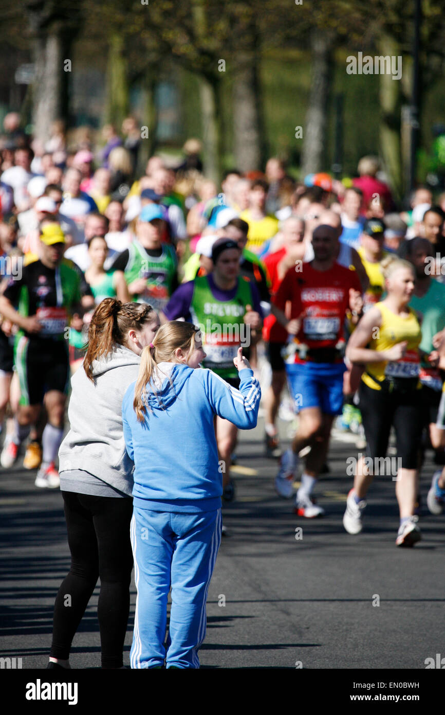 London, UK - April 21, 2013: Supporters watch and cheer thousands of ...