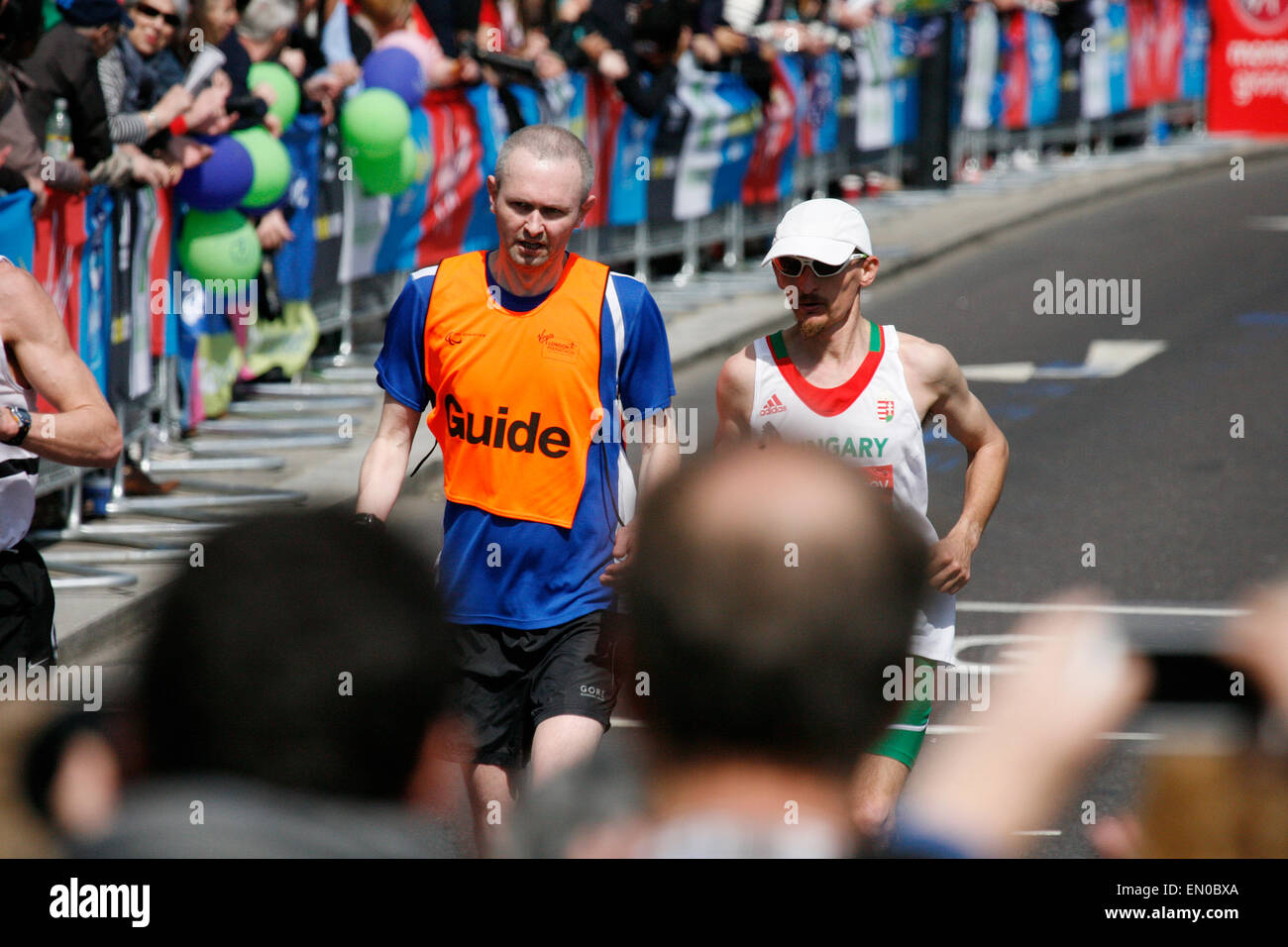 Helping runner marathon hi-res stock photography and images - Alamy