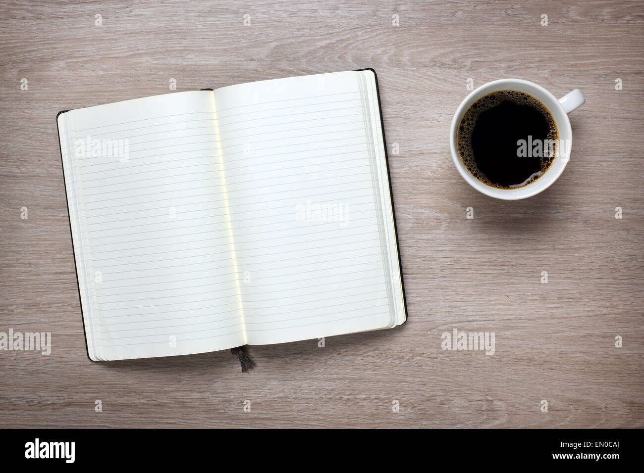 Open book on office desk Stock Photo - Alamy
