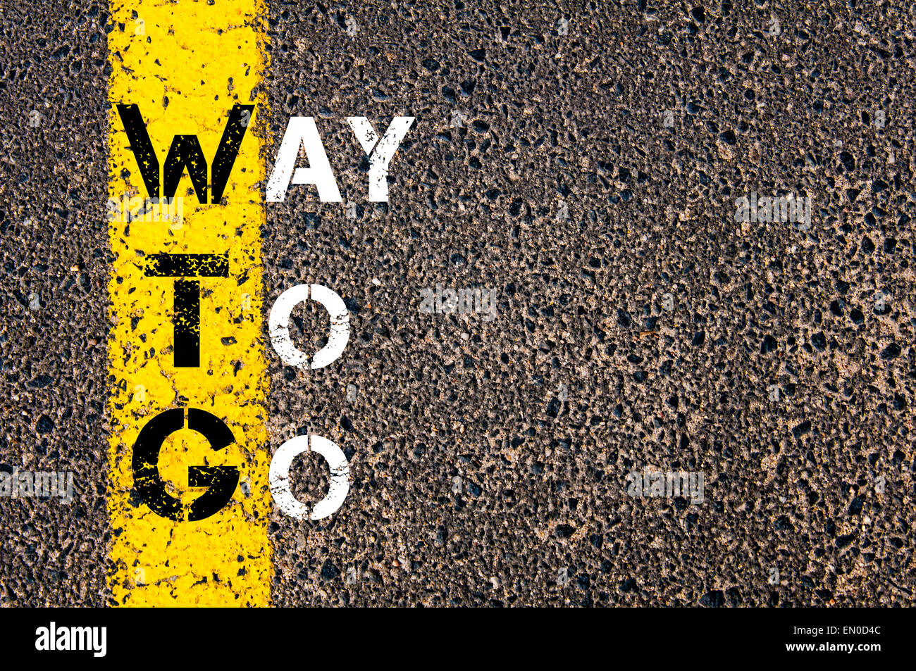 Business Acronym WTG as WAY TO GO. Yellow paint line on the road ...