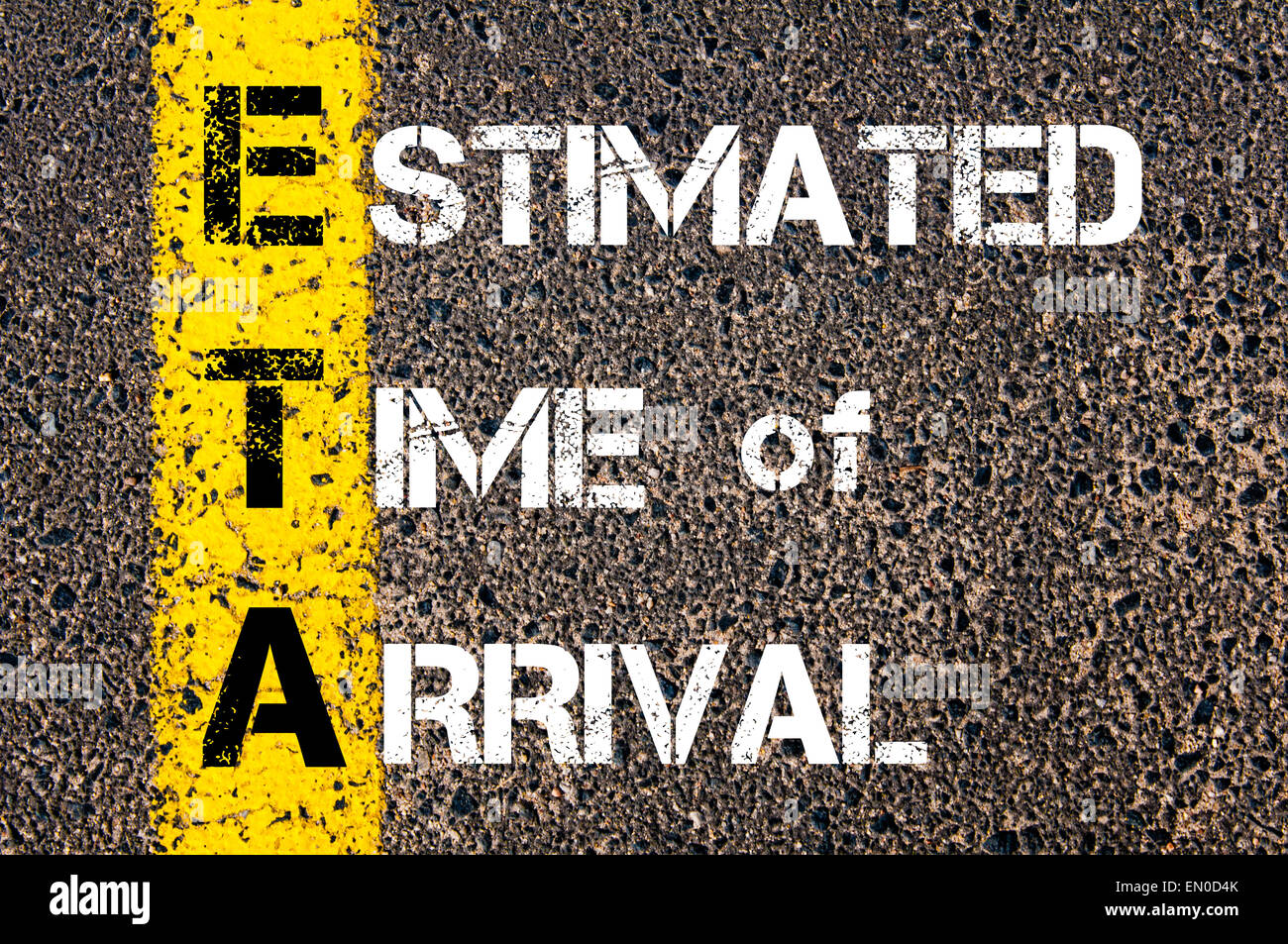 Business Acronym ETA as ESTIMATED TIME OF ARRIVAL. Yellow paint line on ...