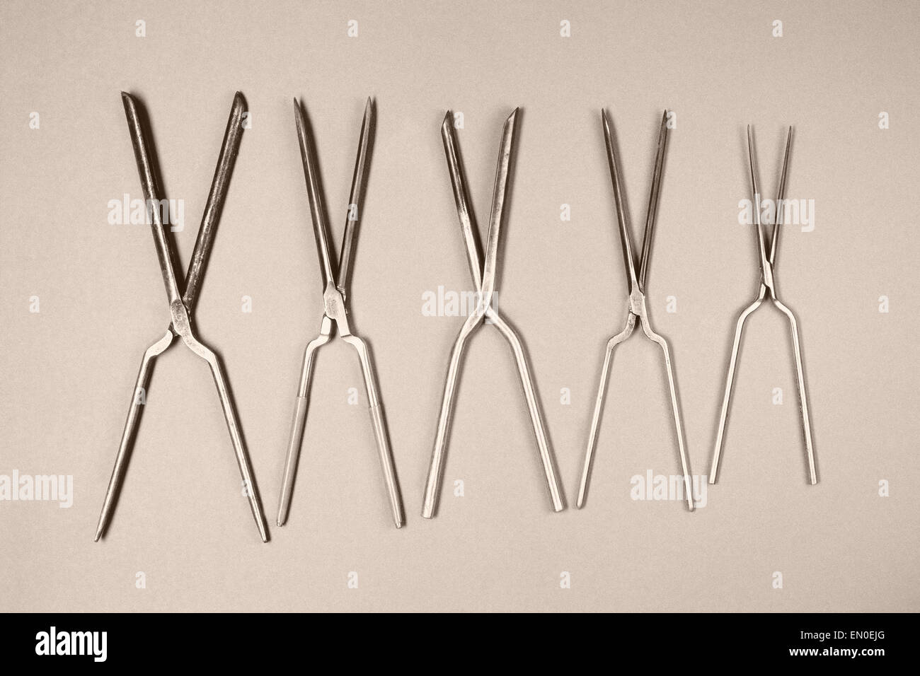 Set of Old Curling Irons Stock Photo - Alamy