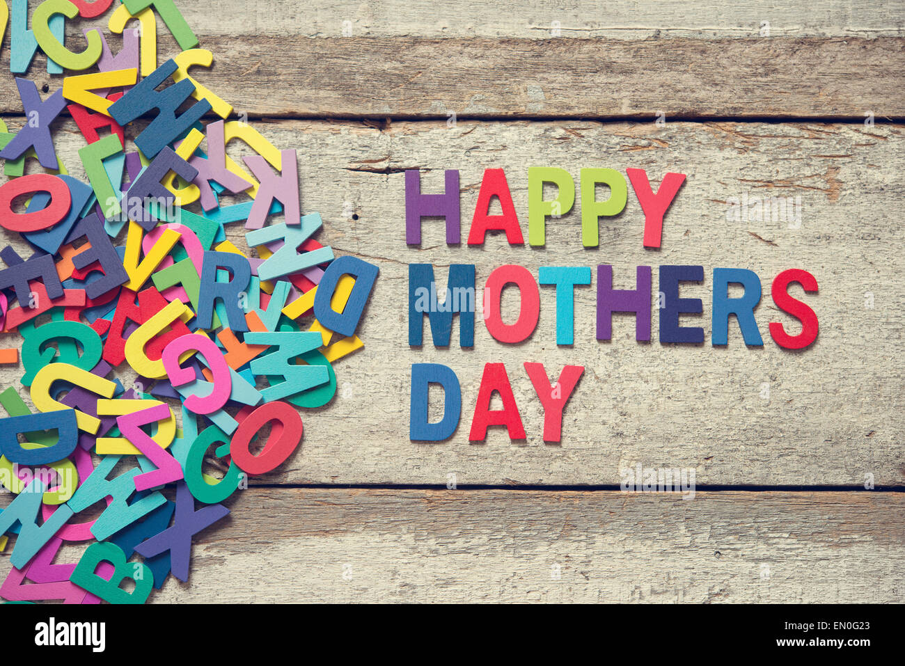 The colorful words "HAPPY MOTHERS DAY" on old wooden plank Stock Photo ...