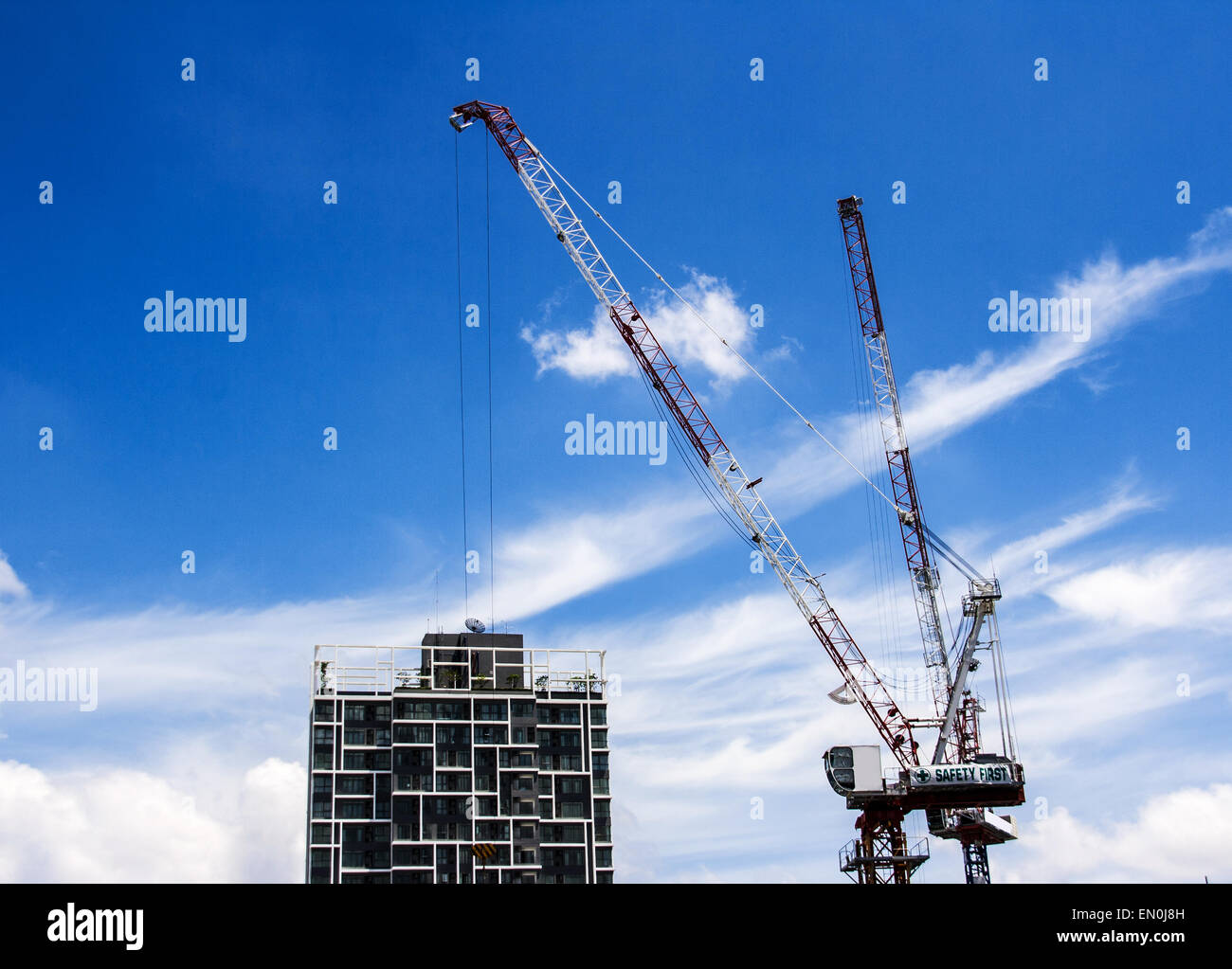construction highrise building on the blue sky Stock Photo - Alamy