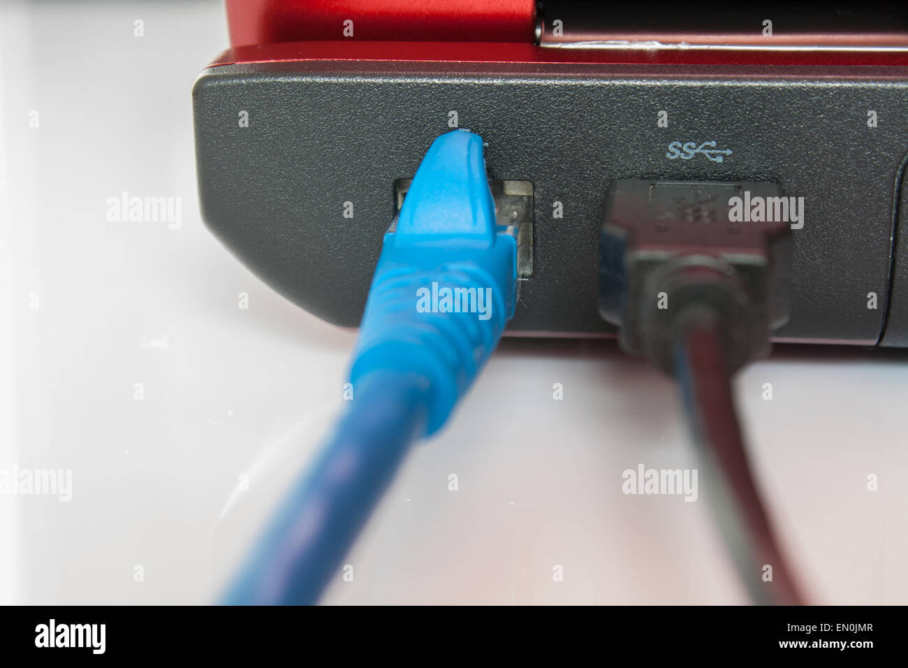 USB cable and Lan cable are connecting to laptop computer Stock Photo ...