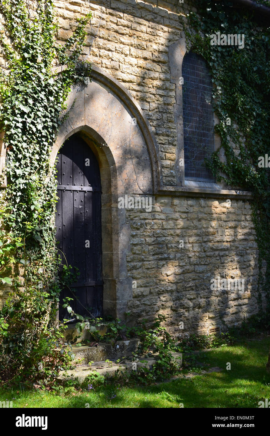 Side arched entrance to a English church in Horley, Surrey Stock Photo ...