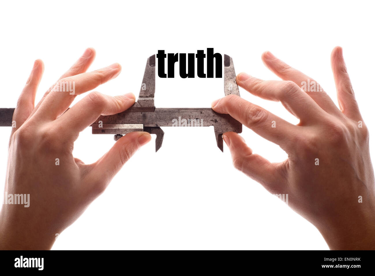 Color horizontal shot of two hands holding a caliper and measuring the ...