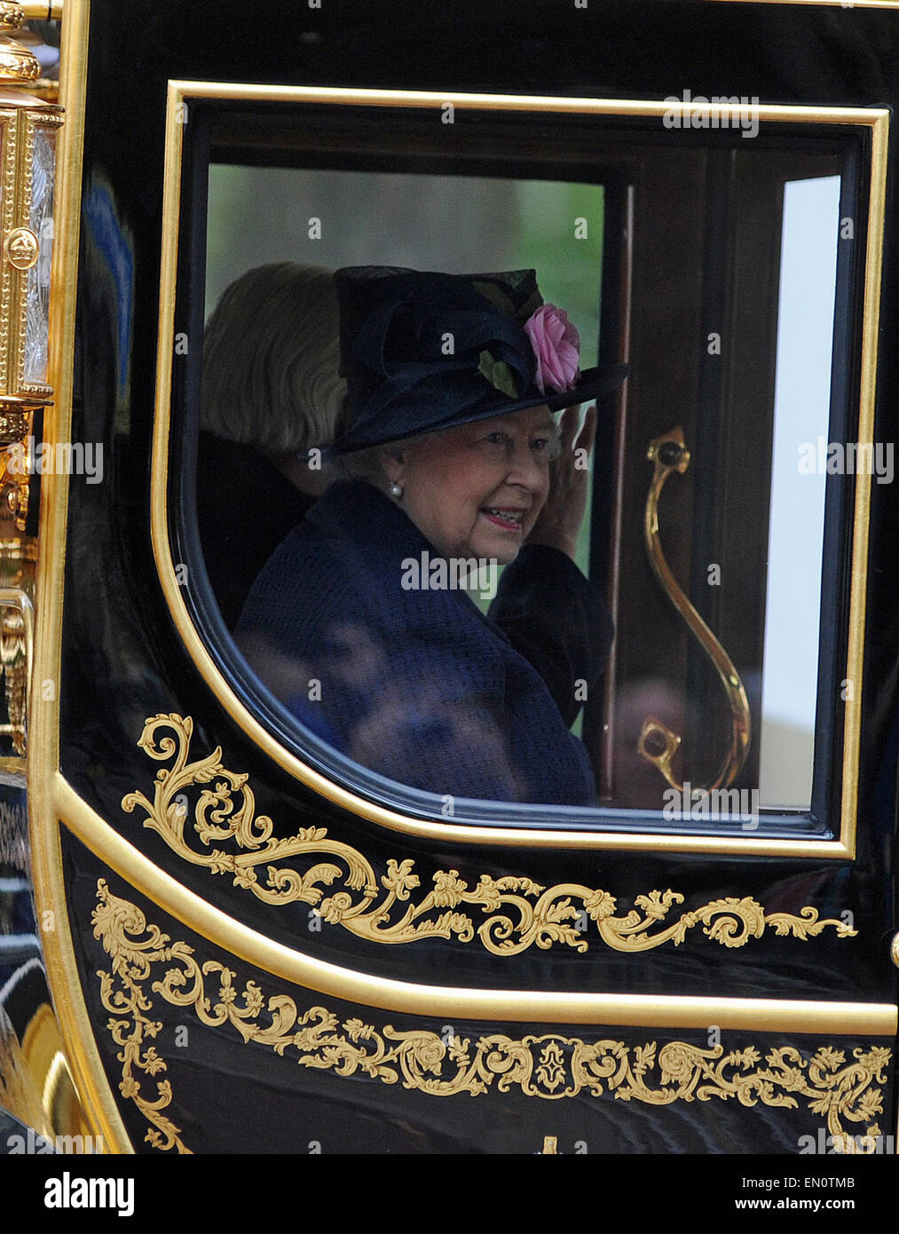 Queen Elizabeth II is driven along The Mall in a Royal carriage to ...