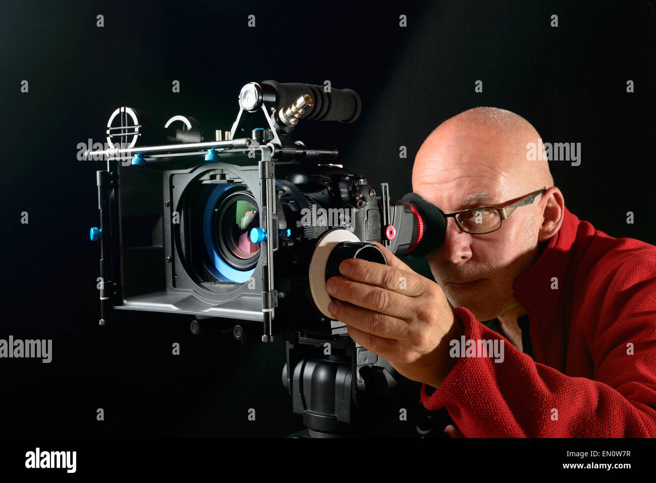 man with a professional movie camera Stock Photo - Alamy