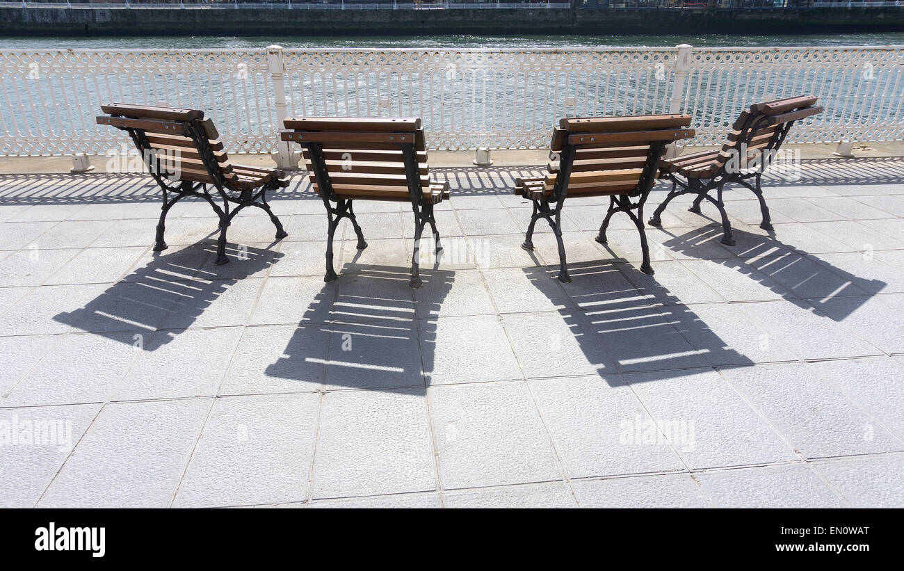wooden benches and their shadows Stock Photo - Alamy