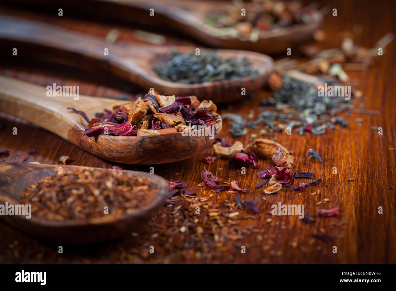 Assortment of dry tea on wooden table Stock Photo - Alamy