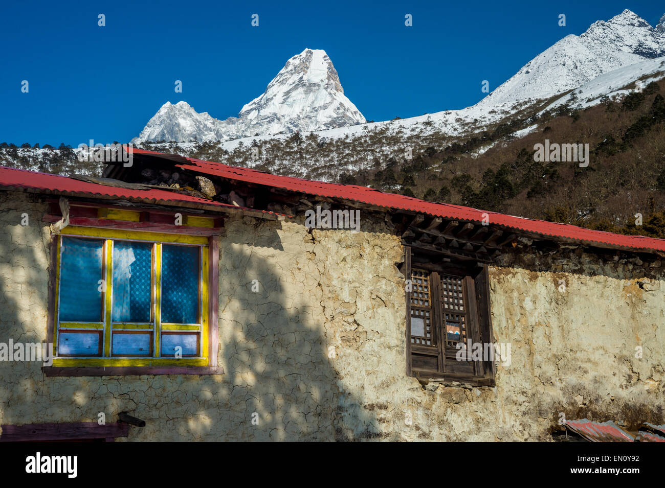 Traditional sherpa house in the himalayas region, with Ama Dablam peak ...