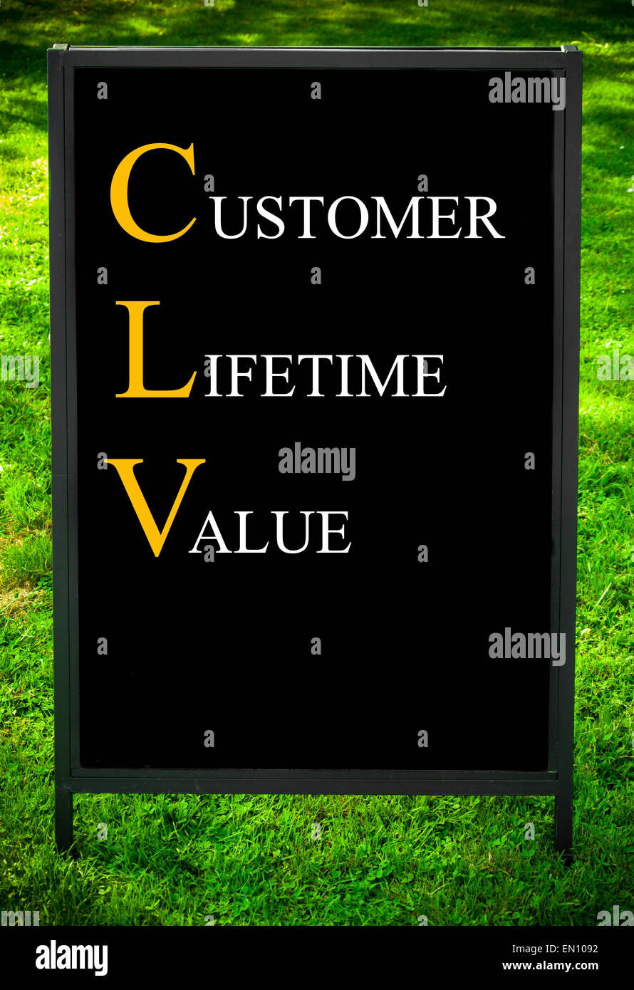 Business Acronym CLV as CUSTOMER LIFETIME VALUE. Message on sidewalk ...